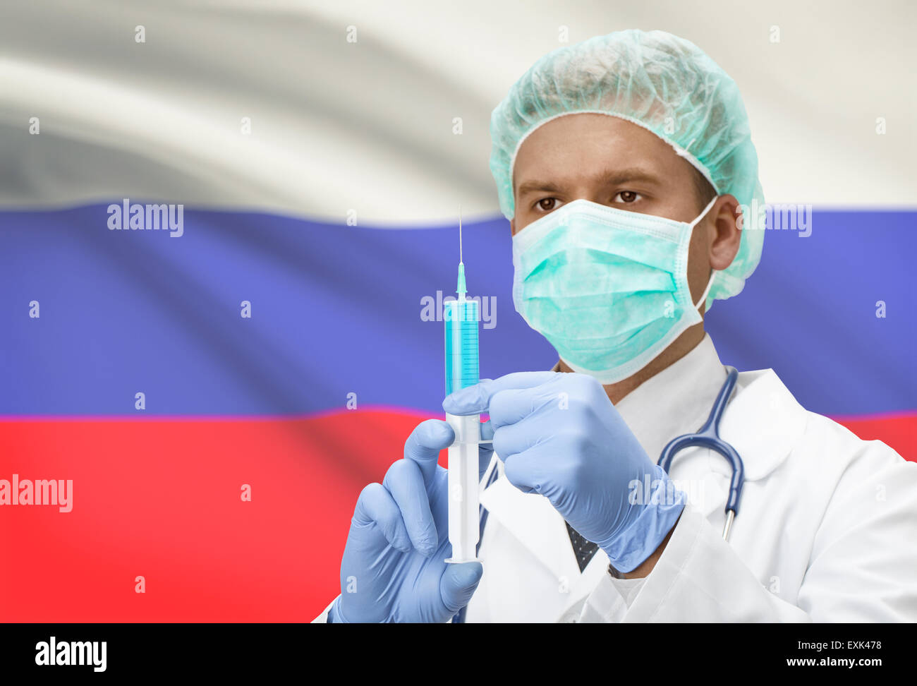 Doctor with syringe in hands and flag on background - Russia Stock ...