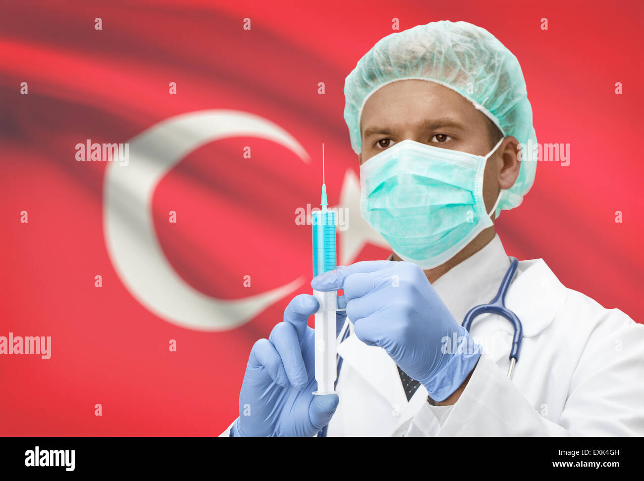 Doctor with syringe in hands and flag on background - Turkey Stock ...