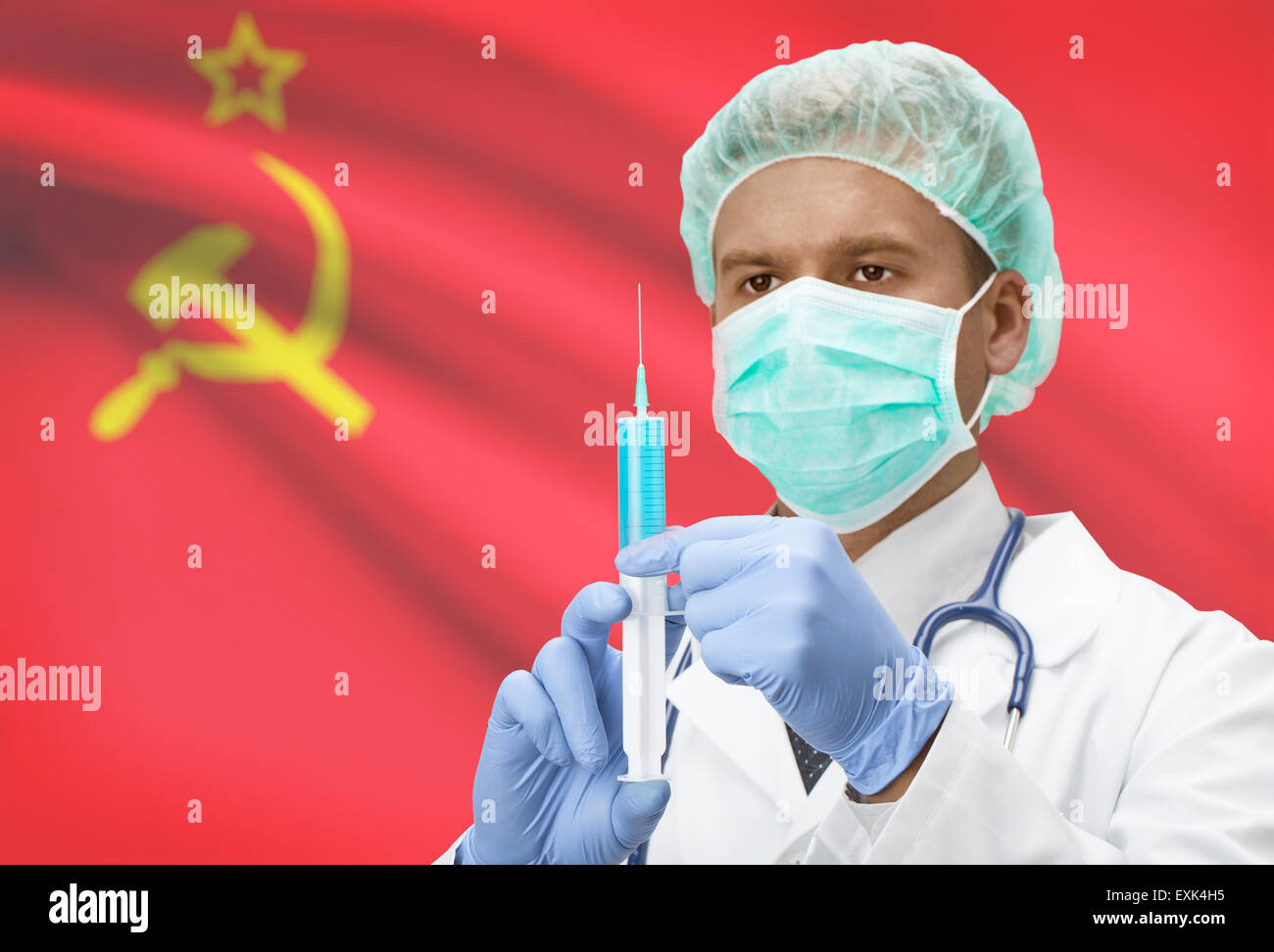 Doctor with syringe in hands and flag on background - USSR - Soviet ...