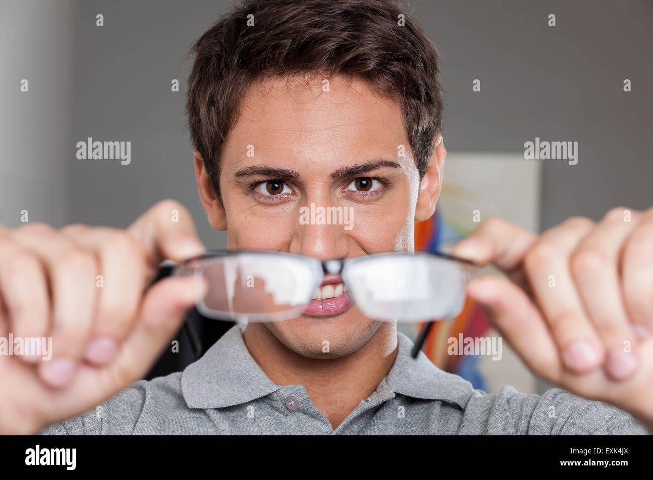 Man checking glasses Stock Photo - Alamy