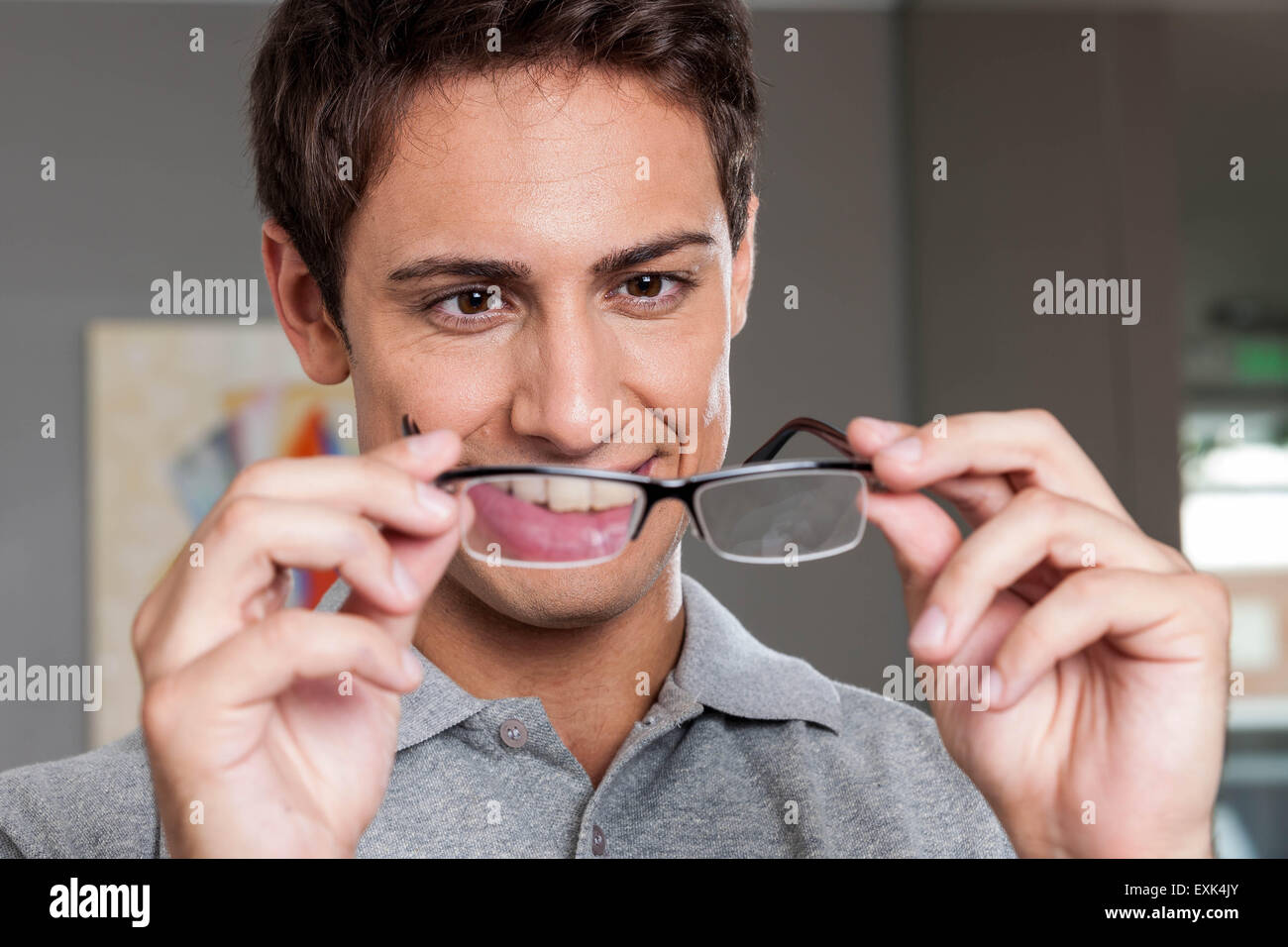 Man checking glasses Stock Photo - Alamy