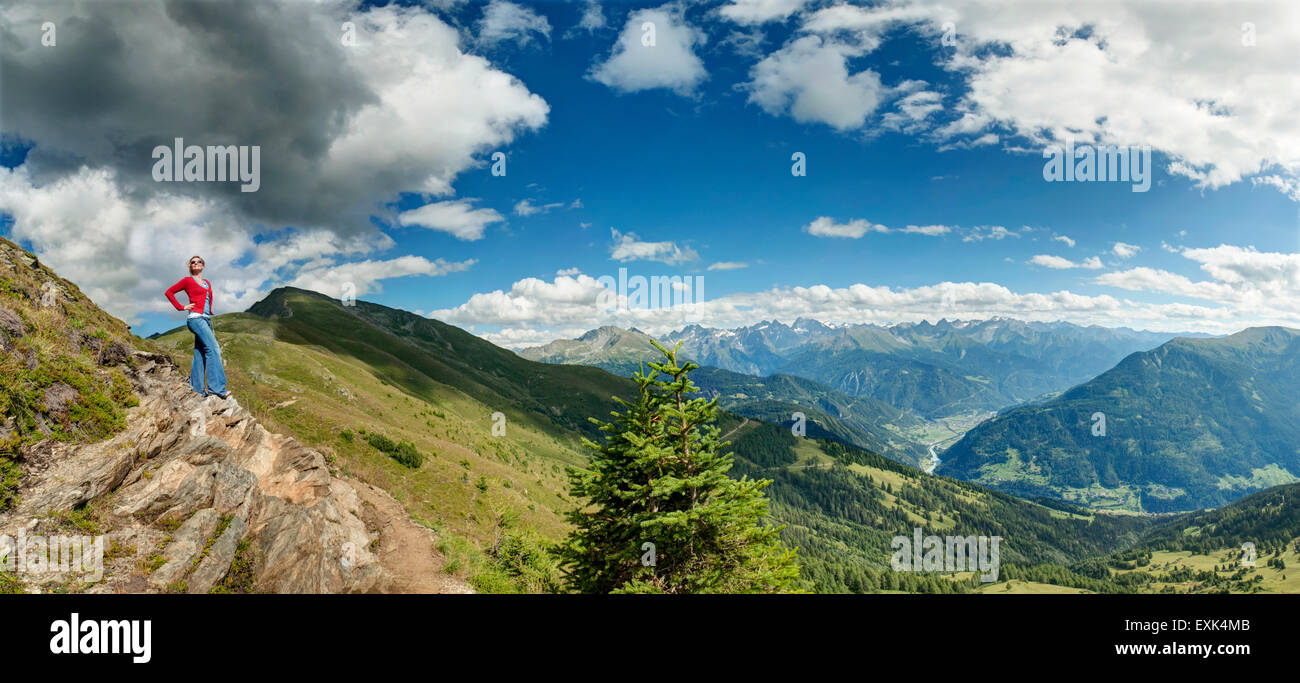 Woman looking at view Stock Photo - Alamy