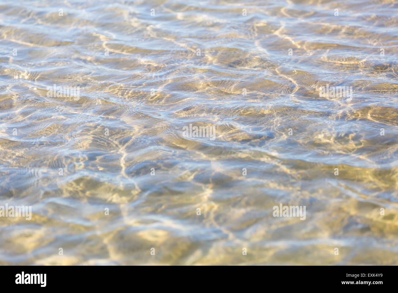 Abstract background of ripples on water surface on sea shore. Beautiful ...