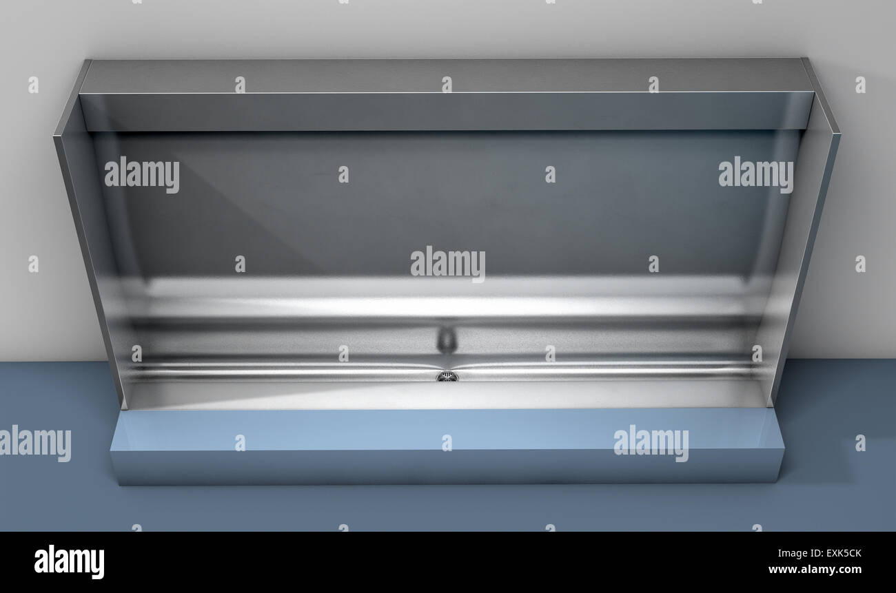 A single stainless steel trough style urinal on a a bathrom background ...