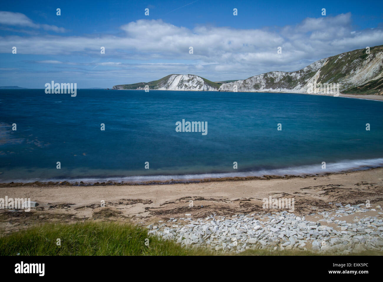 bright blue sky with white chalk cliffs in bay Stock Photo - Alamy