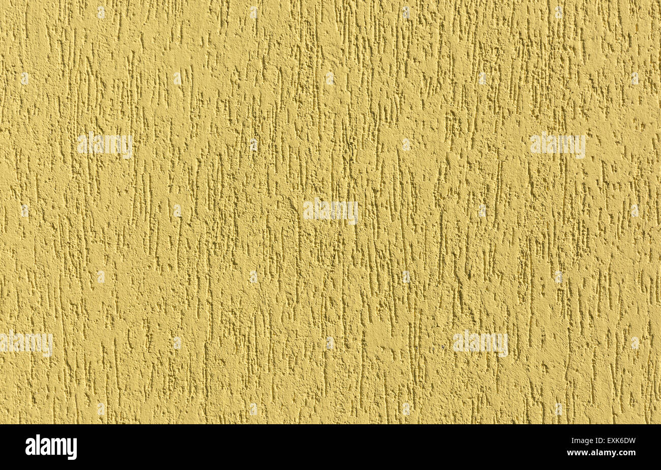 Plastered wall yellow color with a rough texture Stock Photo - Alamy