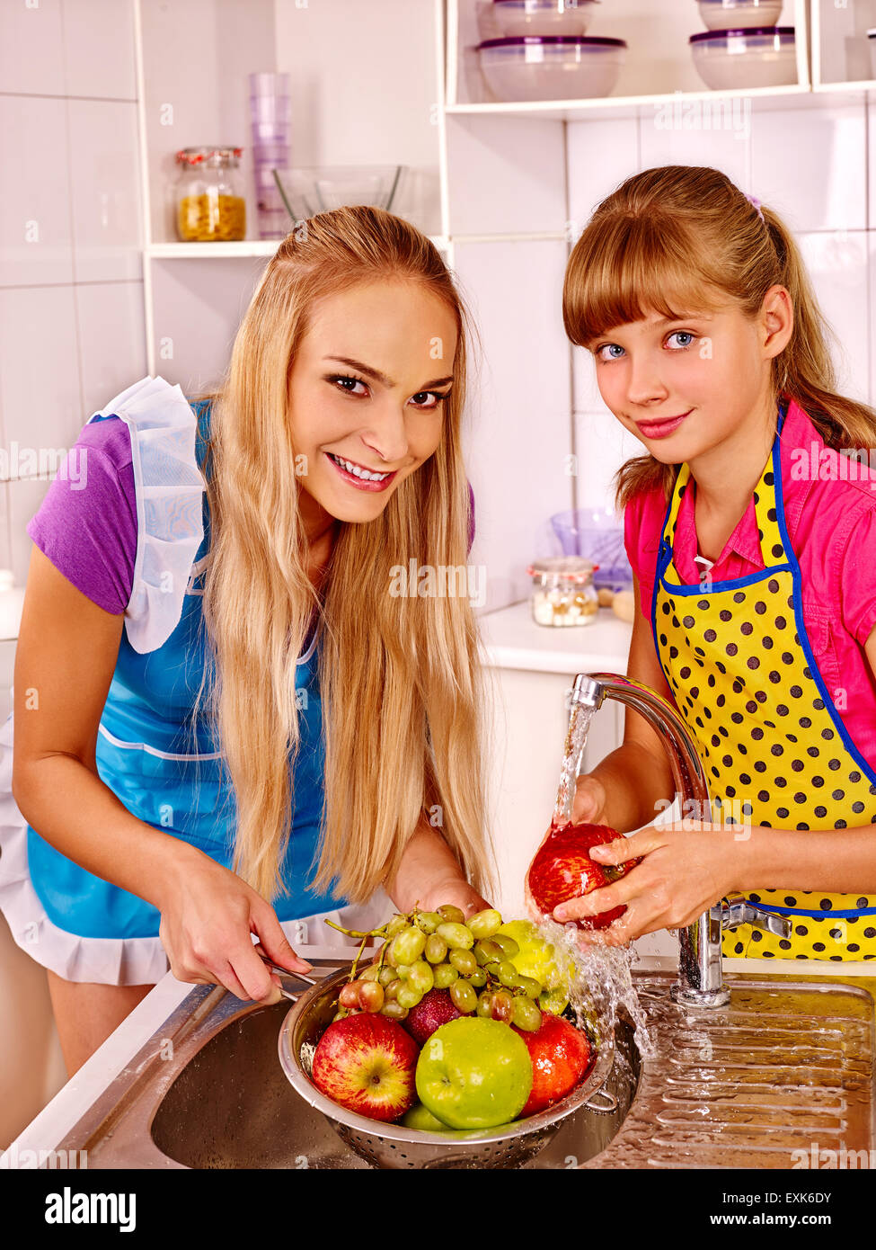 Children washing fruit at kitchen Stock Photo - Alamy