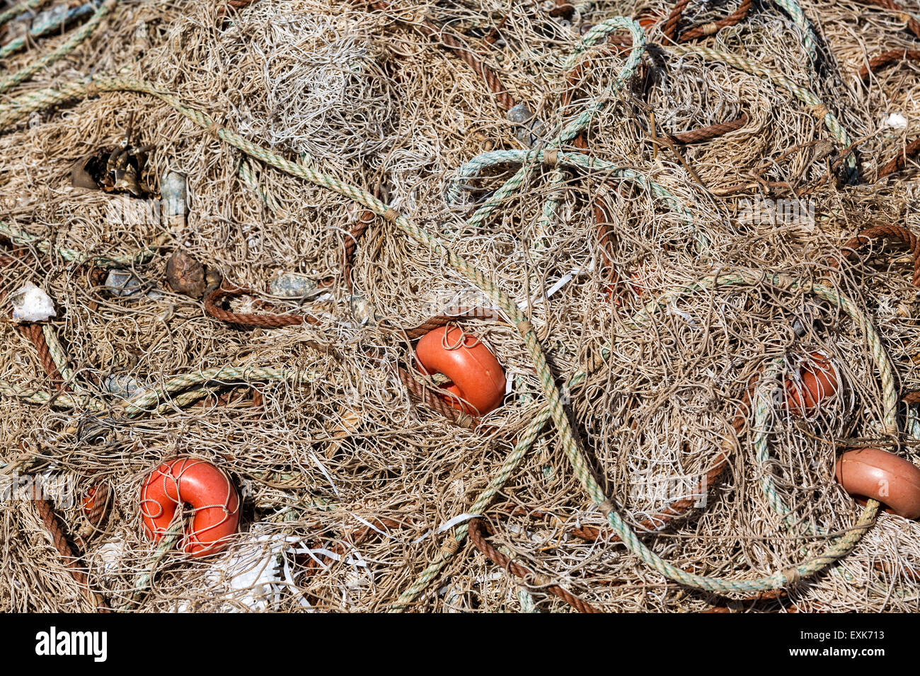 Pile Fishing Net with Red Floats, closeup Stock Photo - Alamy