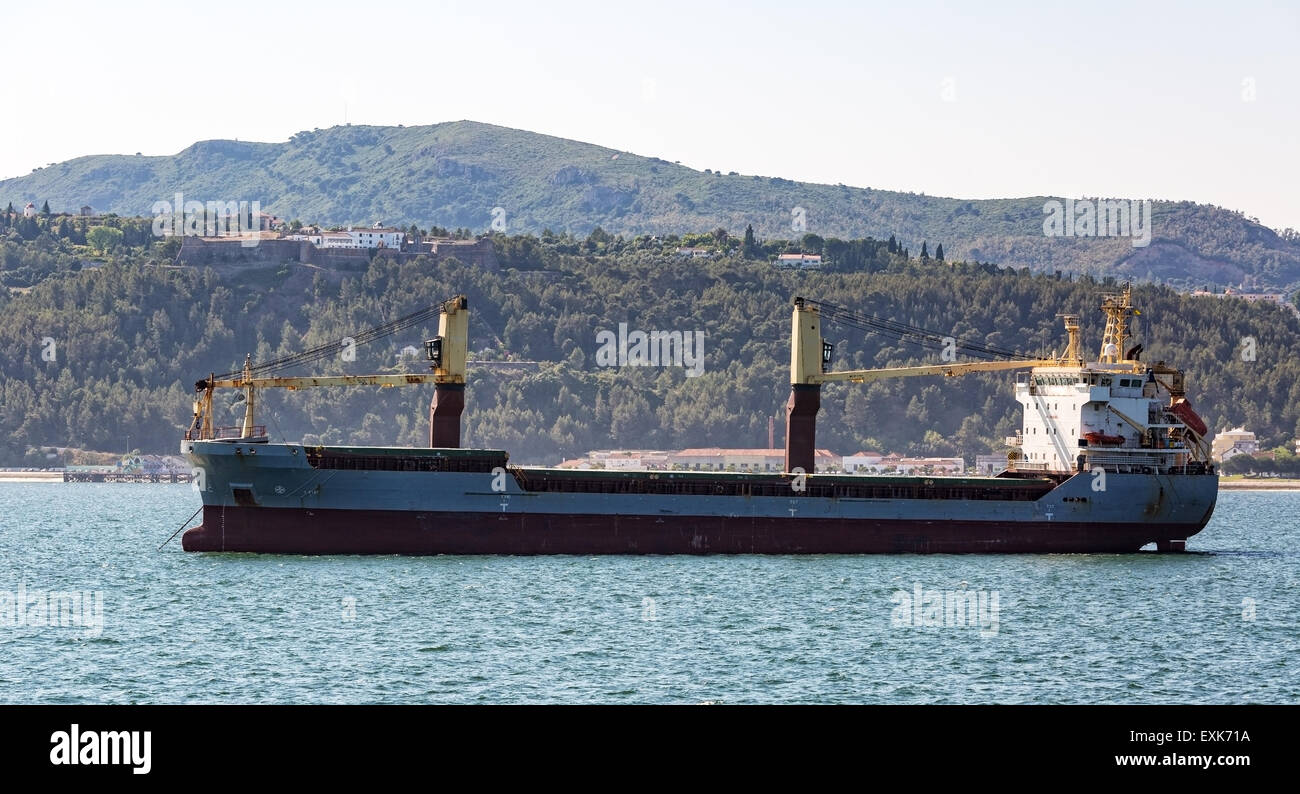 Cargo Ship Sailing in Ocean, sunny day Stock Photo - Alamy