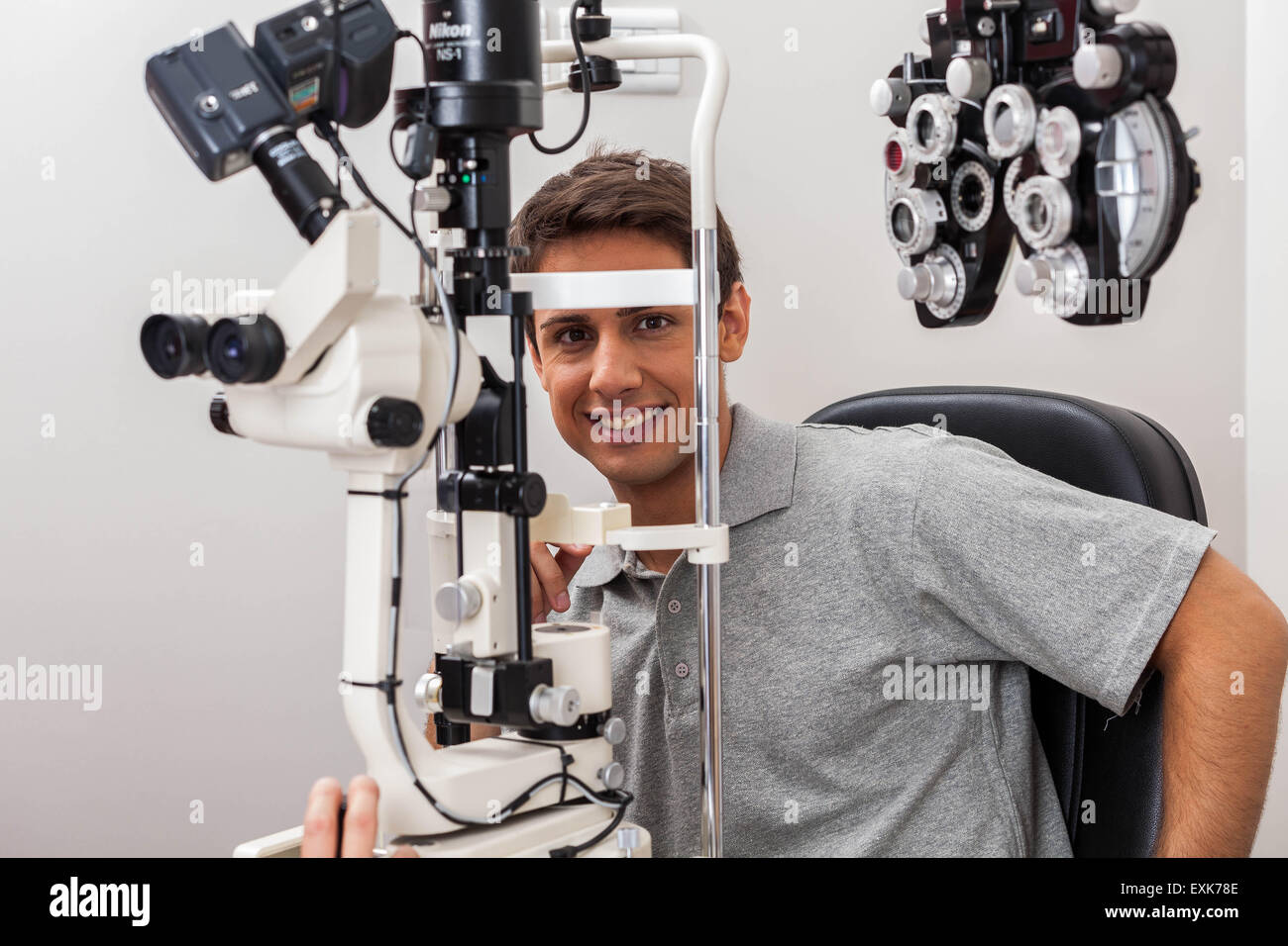 Man checking his eyes Stock Photo - Alamy