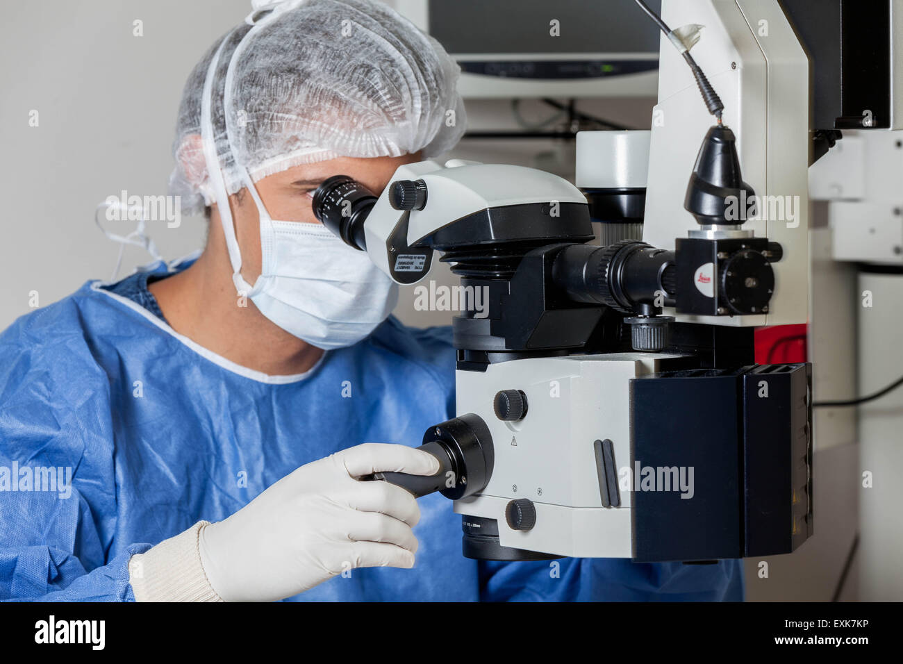 Ophthalmologist doing a eye surgery Stock Photo - Alamy