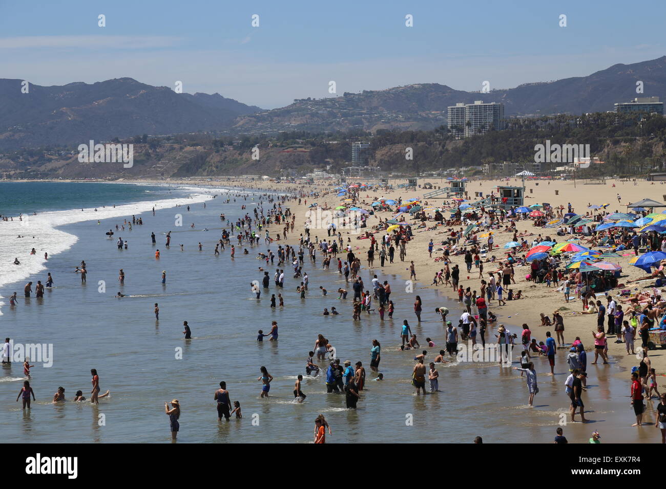 A large group of people gathered at Santa Monica Beach in California ...