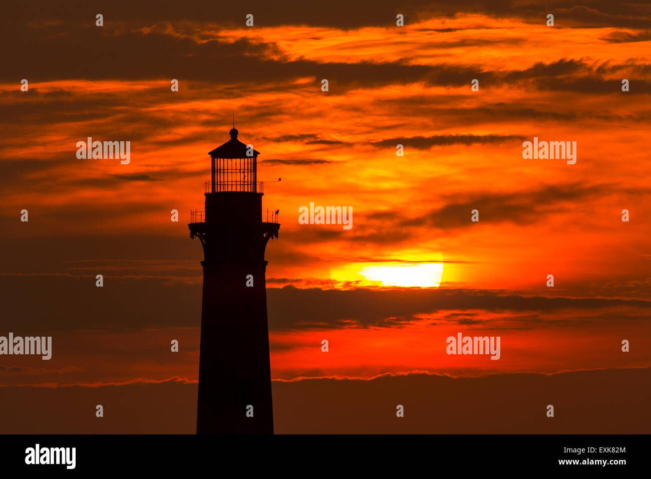 Sunrise over Morris Island Light house seen from Folly Beach July 13 ...