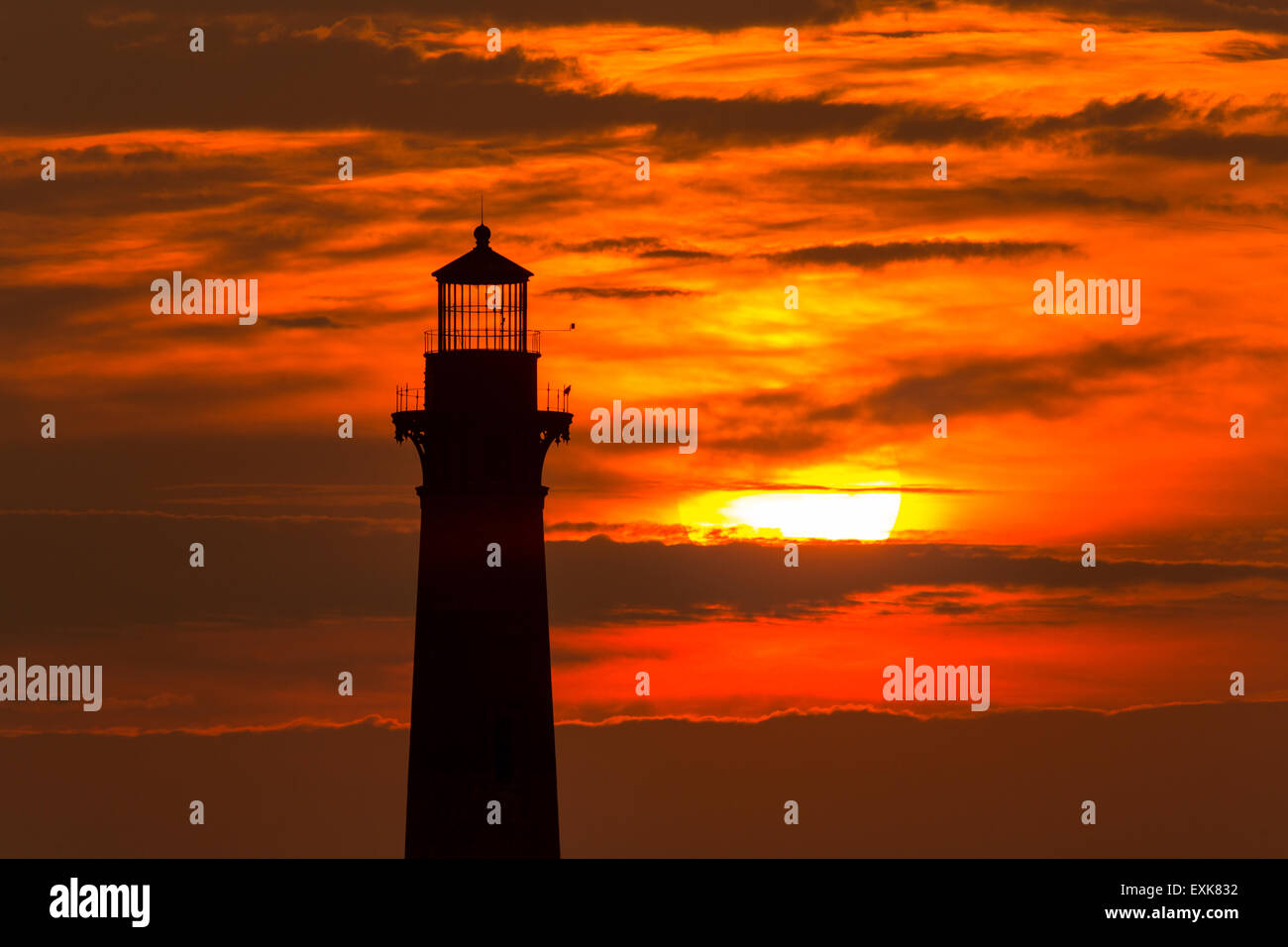 Sunrise over Morris Island Light house seen from Folly Beach July 13 ...