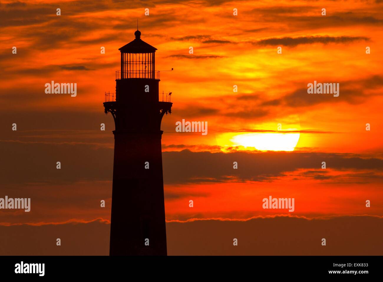 Sunrise over Morris Island Light house seen from Folly Beach July 13 ...