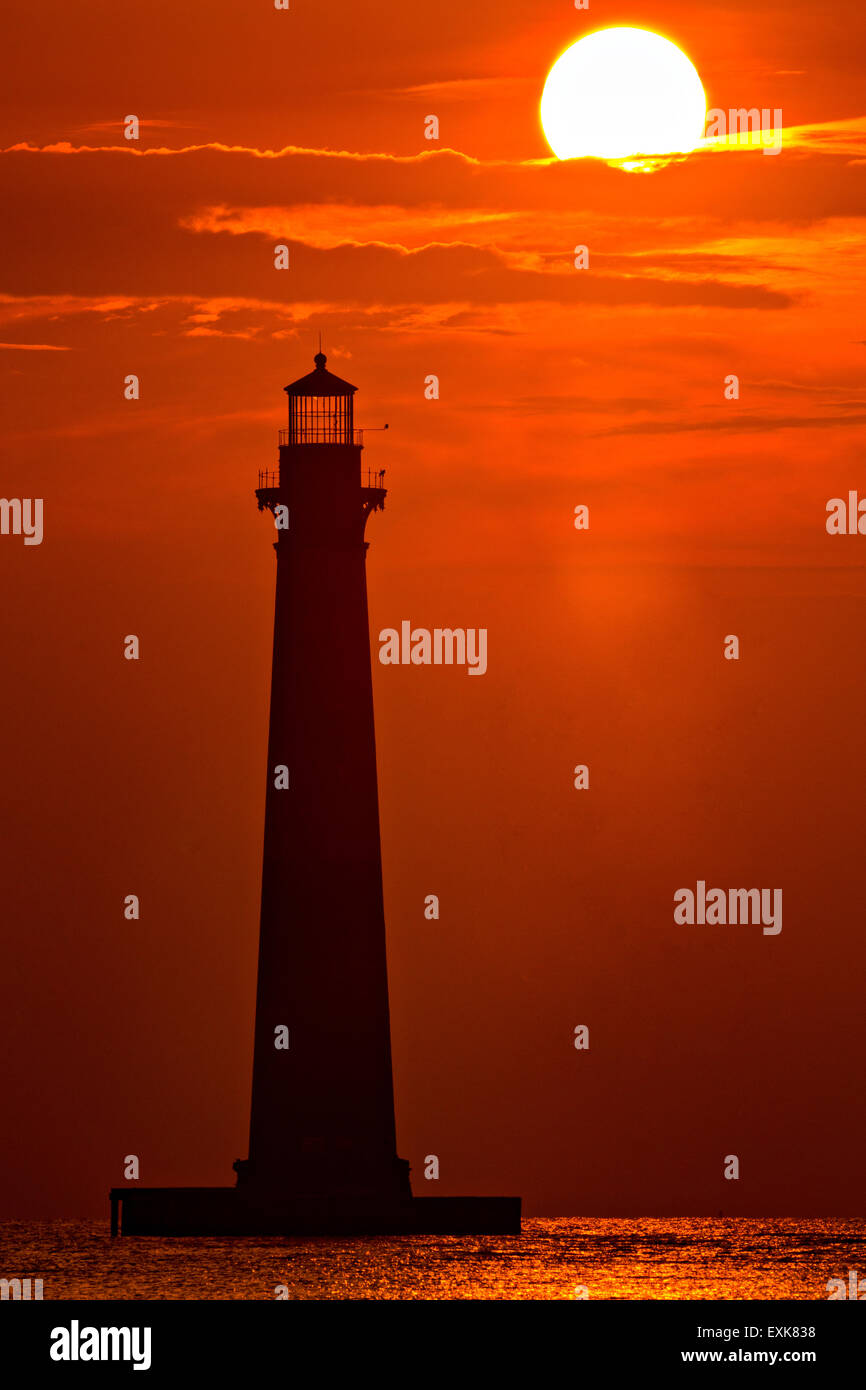 Sunrise over Morris Island Light house seen from Folly Beach July 13 ...