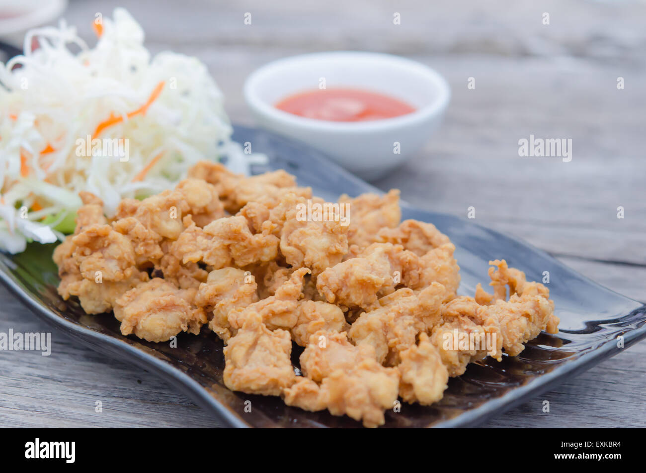 deep fried chicken tendons with fresh vegetable and chili sauce, asian ...