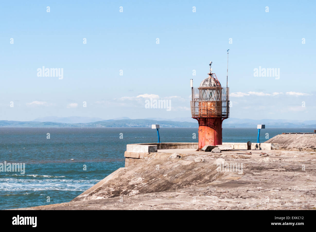 Lighthouse on the South Pier at the entrance to Heysham Port with the ...