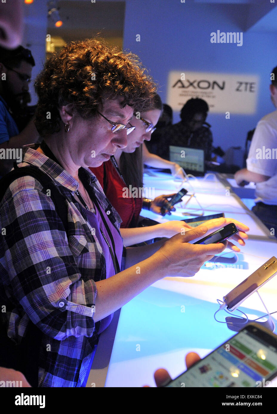 New York, USA. 14th July, 2015. People try the new Axon phone during ...