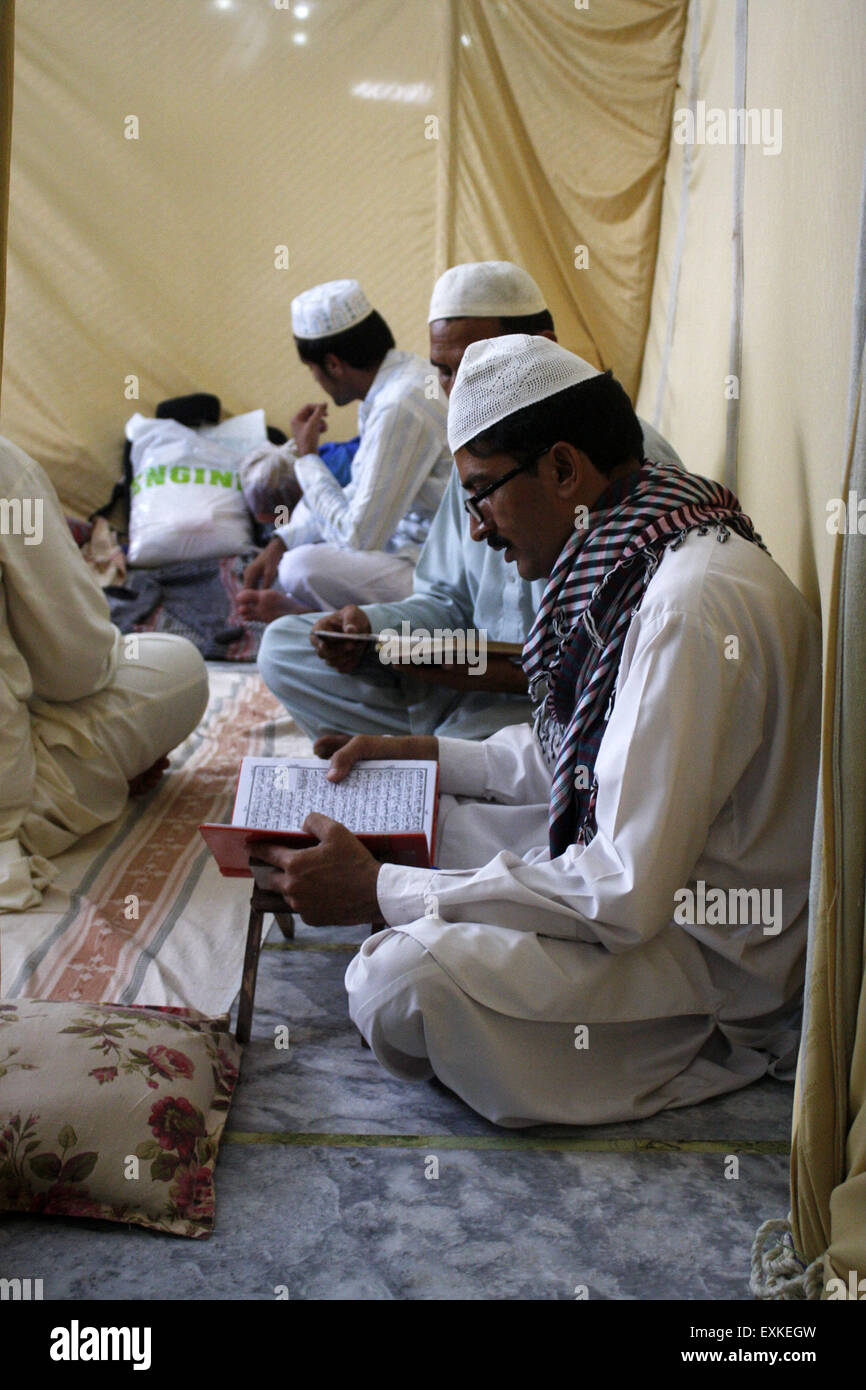 Lahore. 14th July, 2015. Pakistani Muslims read holy Koran at a mosque ...