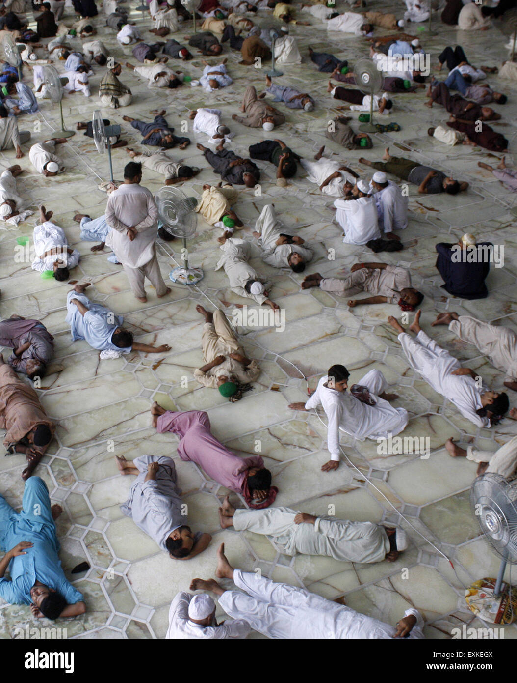 Lahore. 14th July, 2015. Pakistani Muslims rest at a mosque during ...