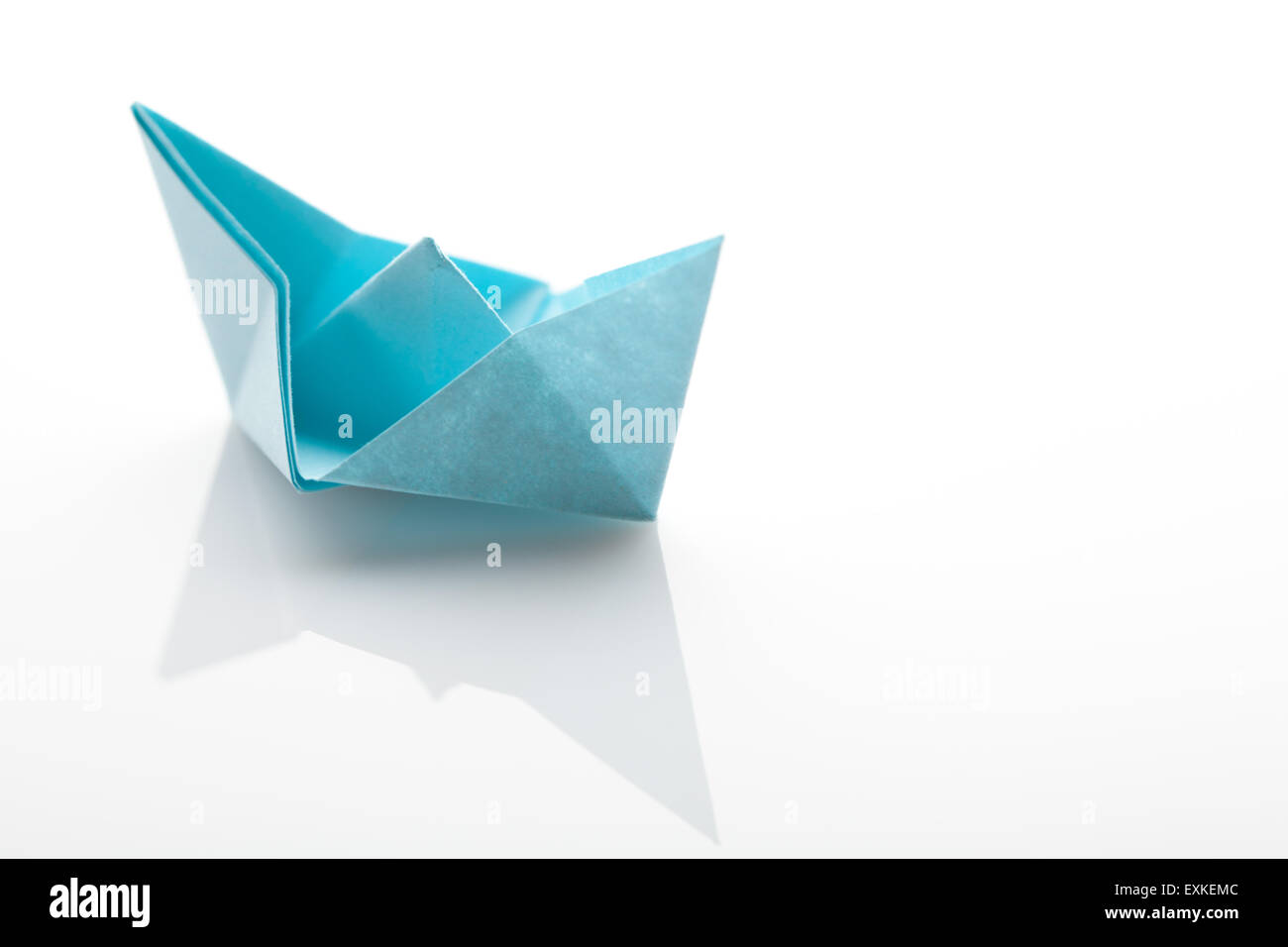 Origami paper ship on white background Stock Photo - Alamy