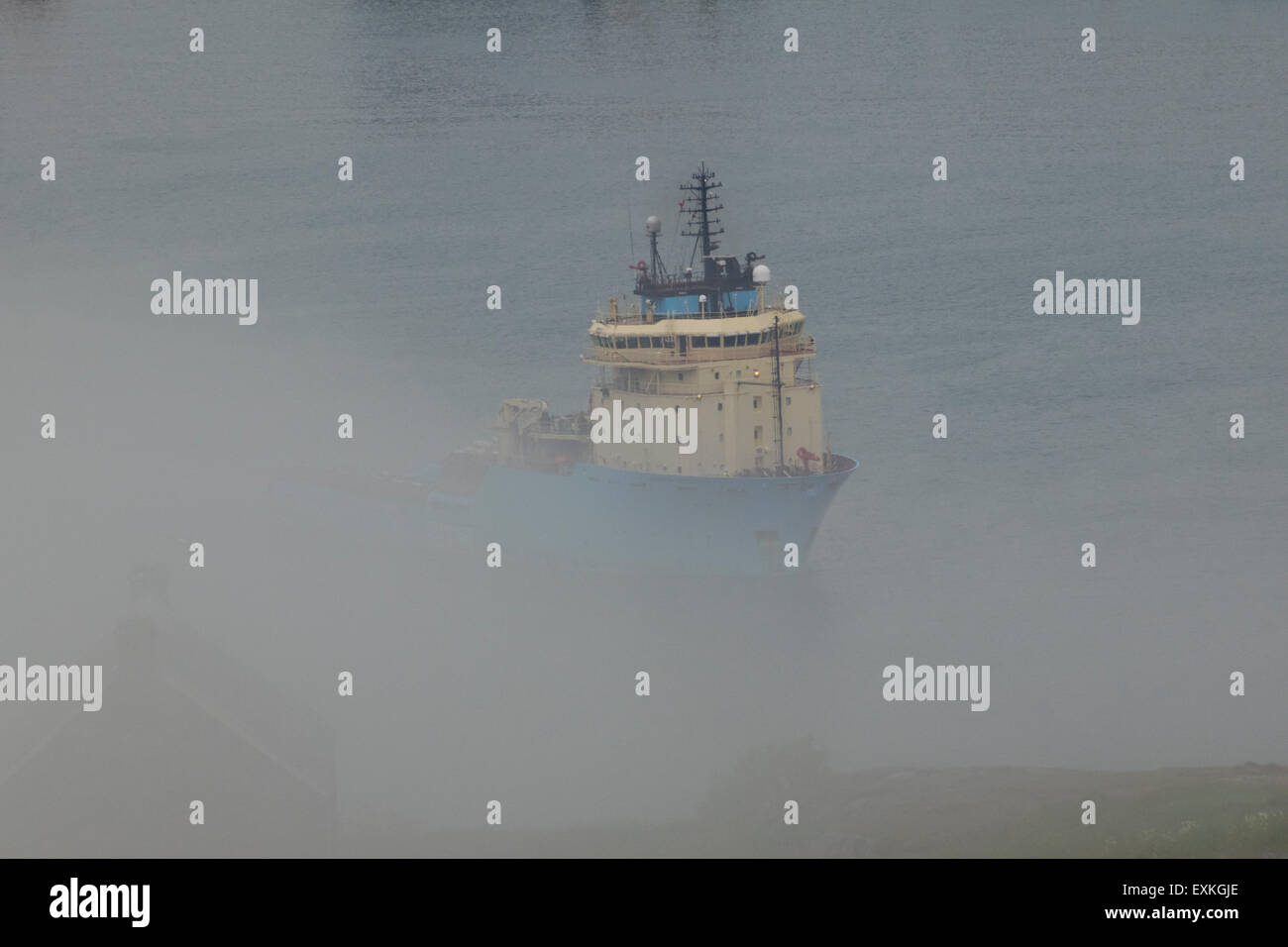 A ship passing through fog in St. John's harbour Stock Photo - Alamy