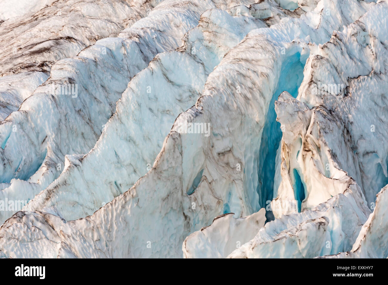 The sharp blueish ridges in the Coleman Glacier reflect the soft ...