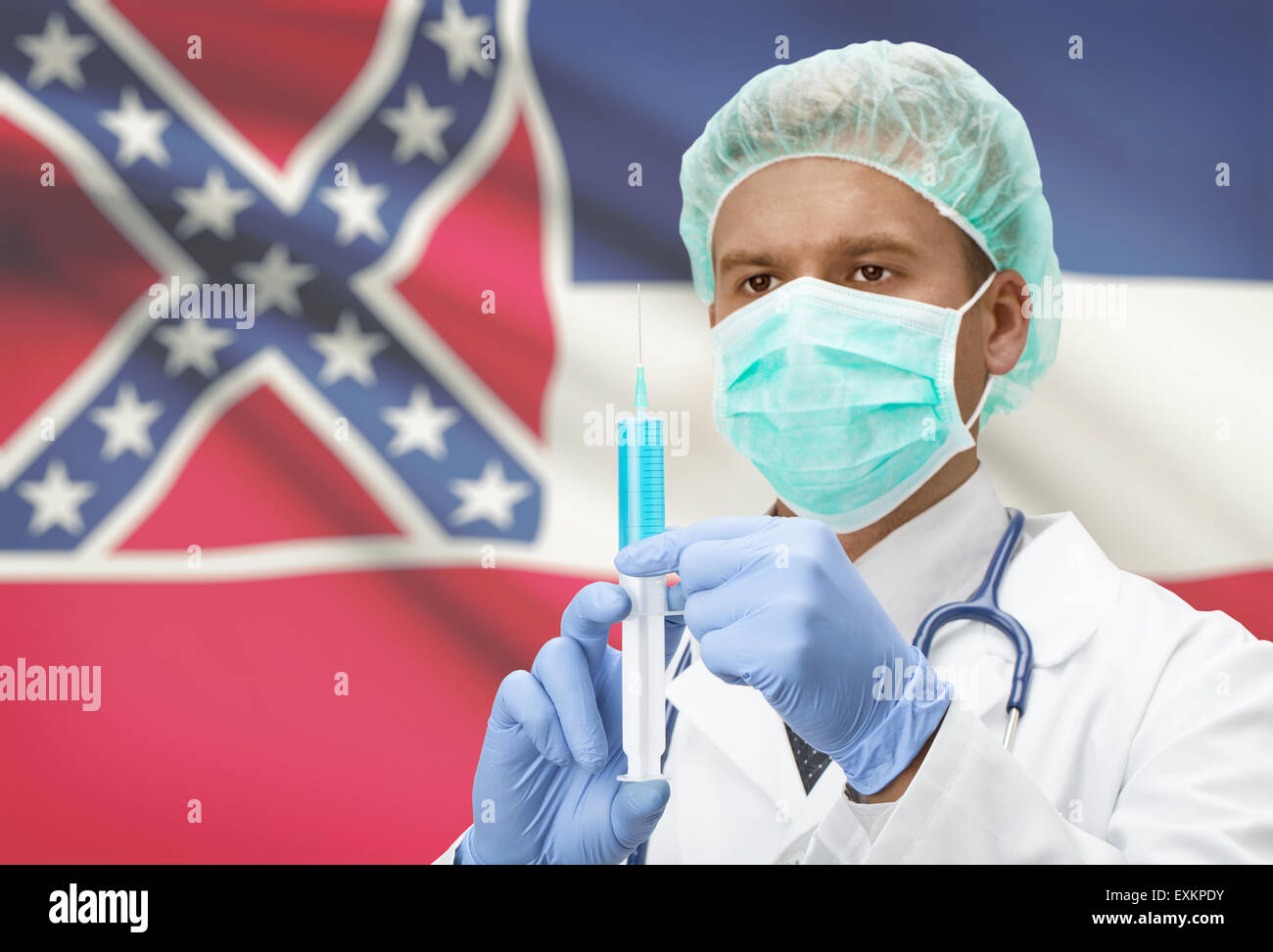 Doctor with syringe in hands and USA states flags on background ...