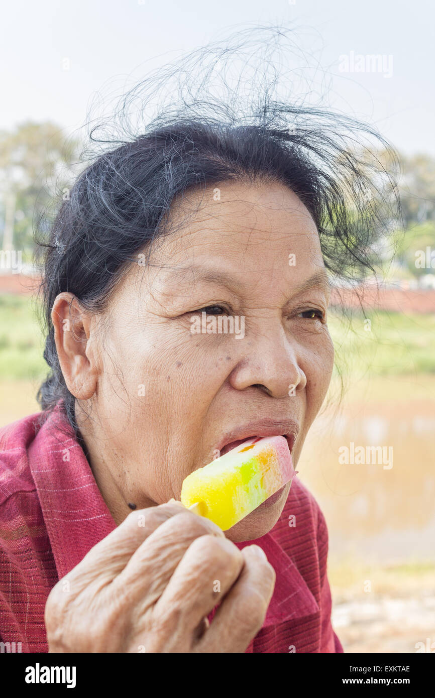 Closeup of Asian Thai old woman eating ice cream Stock Photo - Alamy