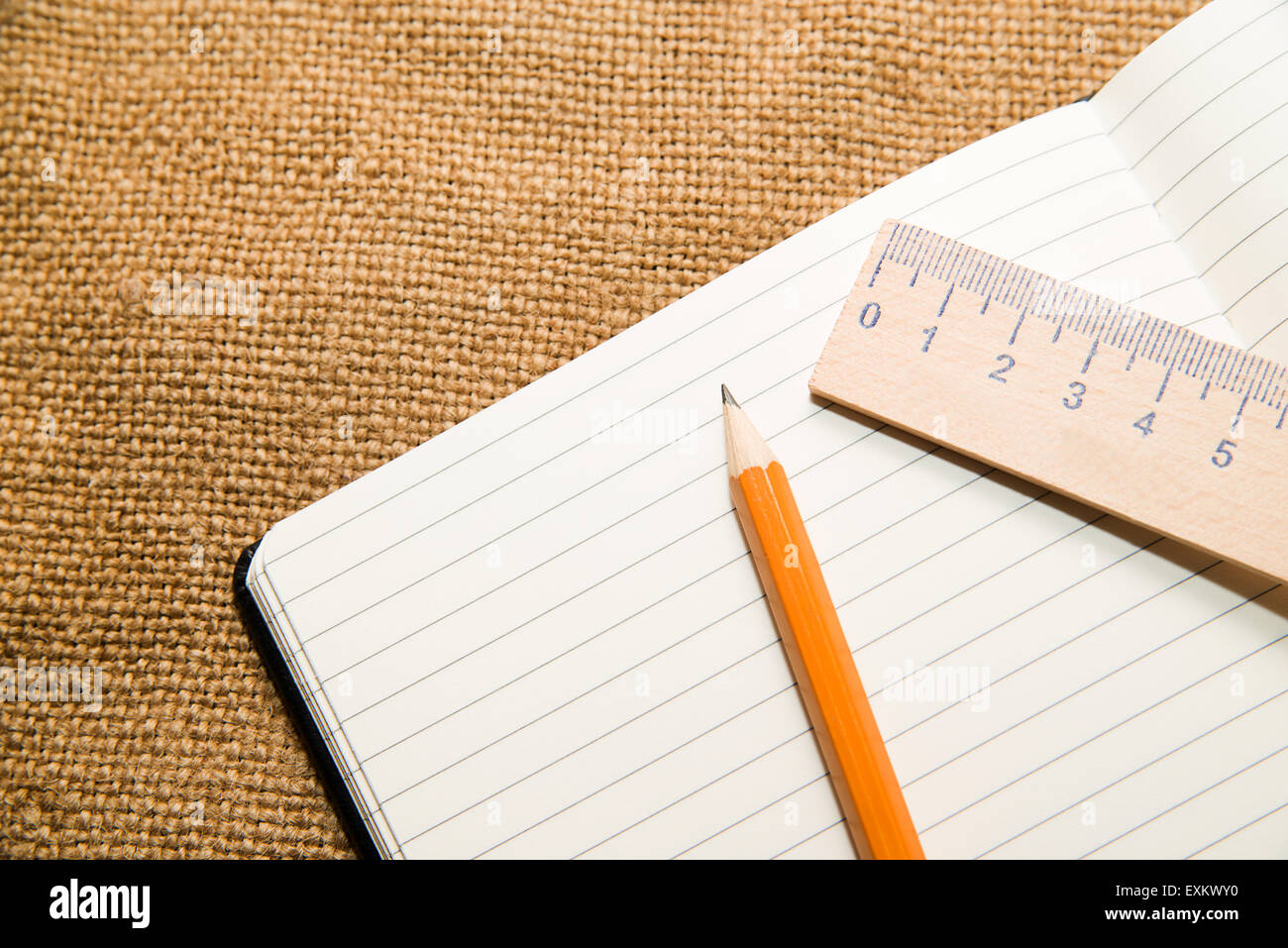 Notepad with a recording sheet, pencil and wooden ruler on the old ...