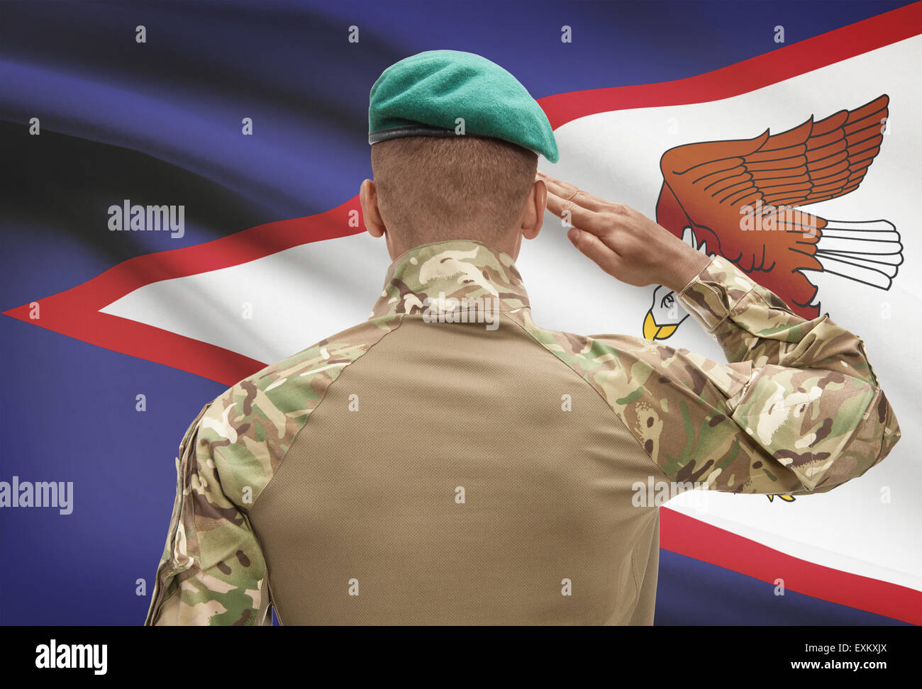Dark-skinned soldier in hat facing national flag series - American ...