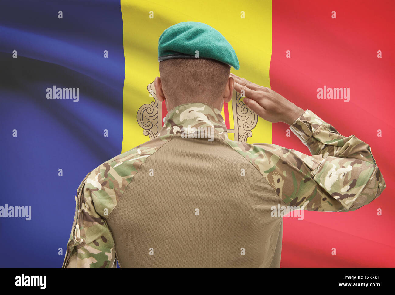 Dark-skinned soldier in hat facing national flag series - Andorra Stock ...