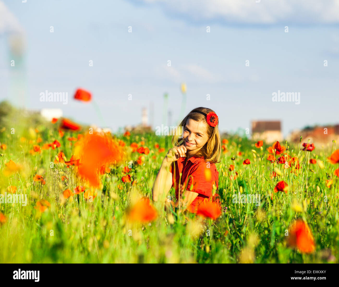 Girl in poppies Stock Photo - Alamy