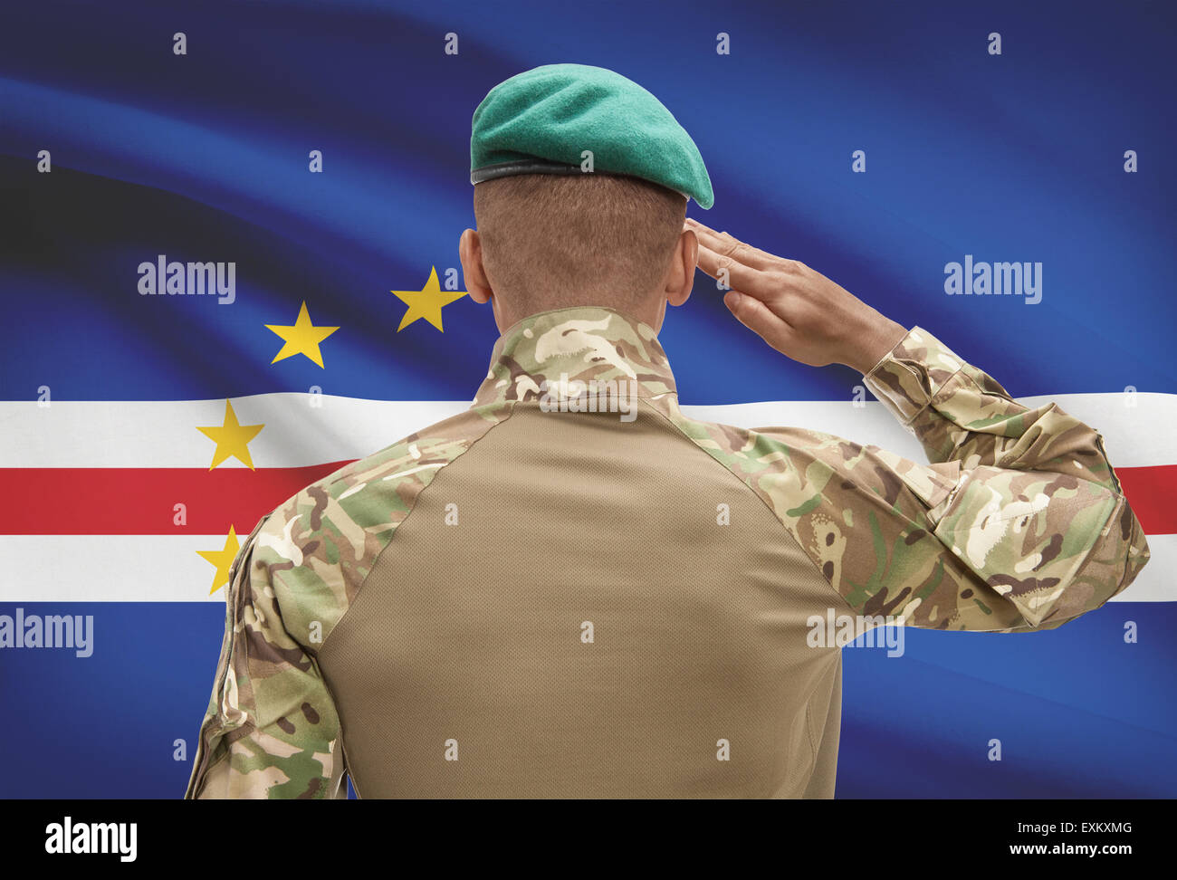 Dark-skinned soldier in hat facing national flag series - Cape Verde ...