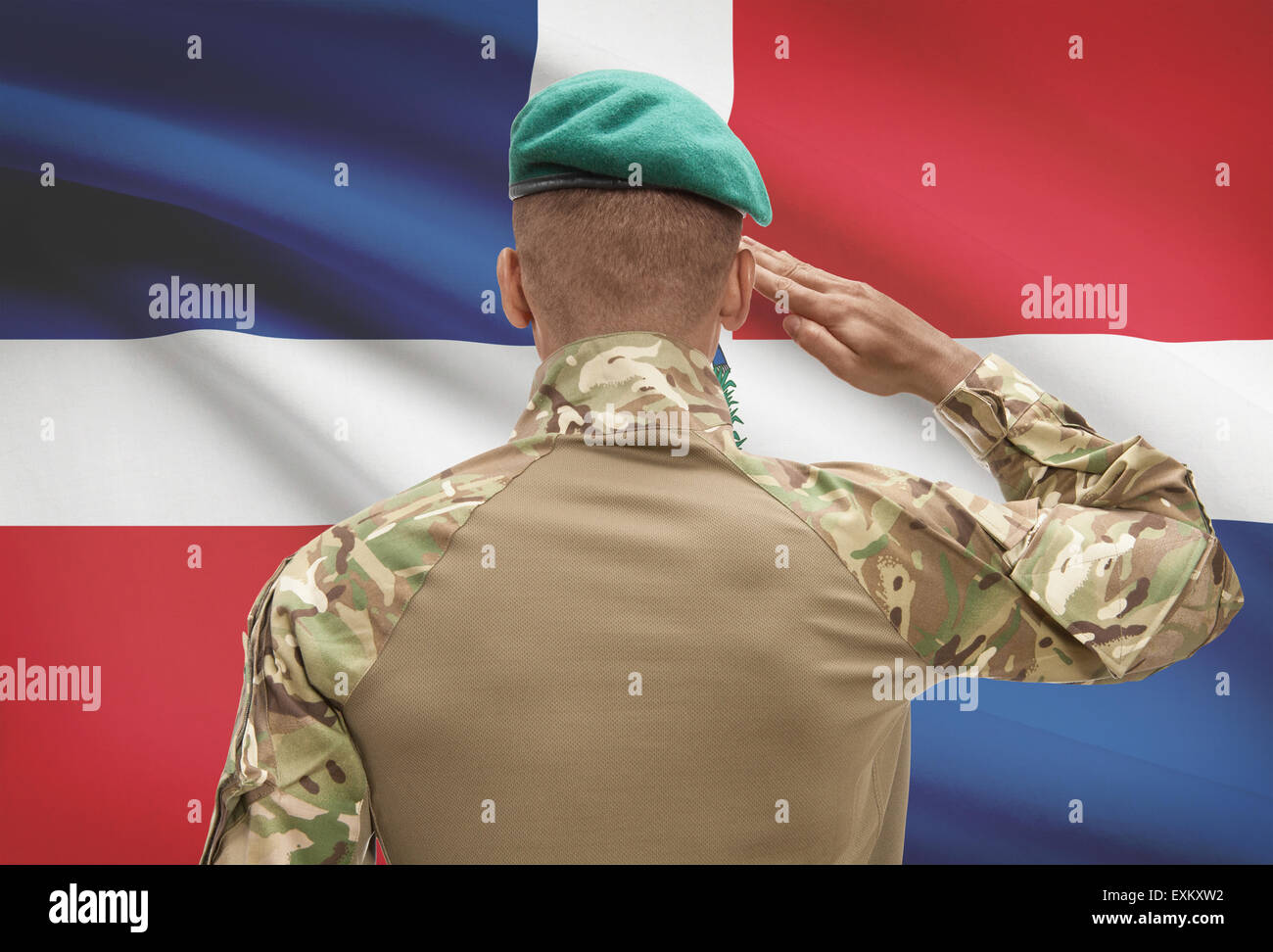 Dark-skinned soldier in hat facing national flag series - Dominican ...