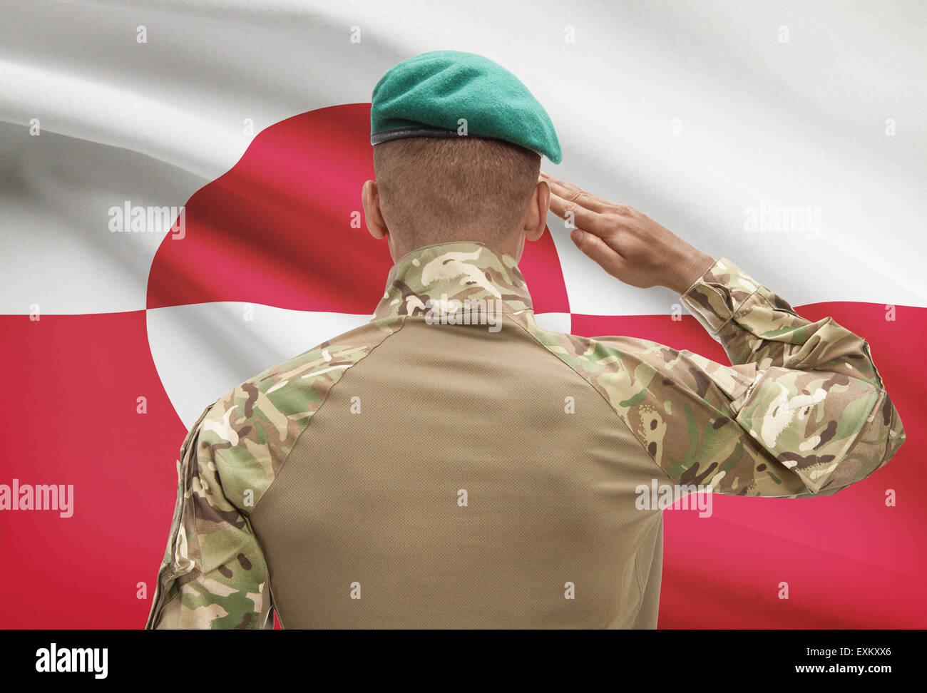 Dark-skinned soldier in hat facing national flag series - Greenland ...