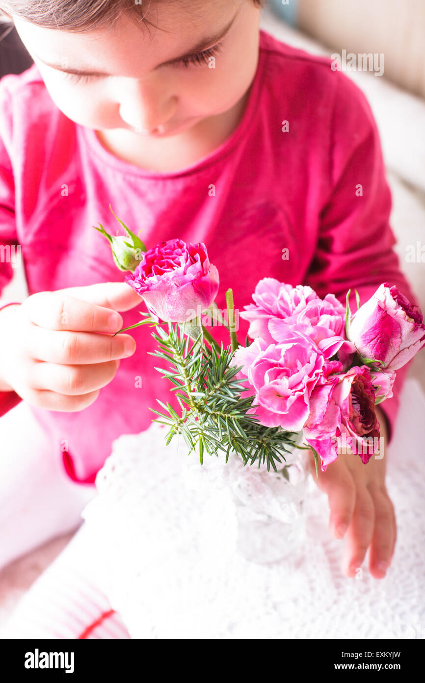 Child smelling rose hi-res stock photography and images - Alamy