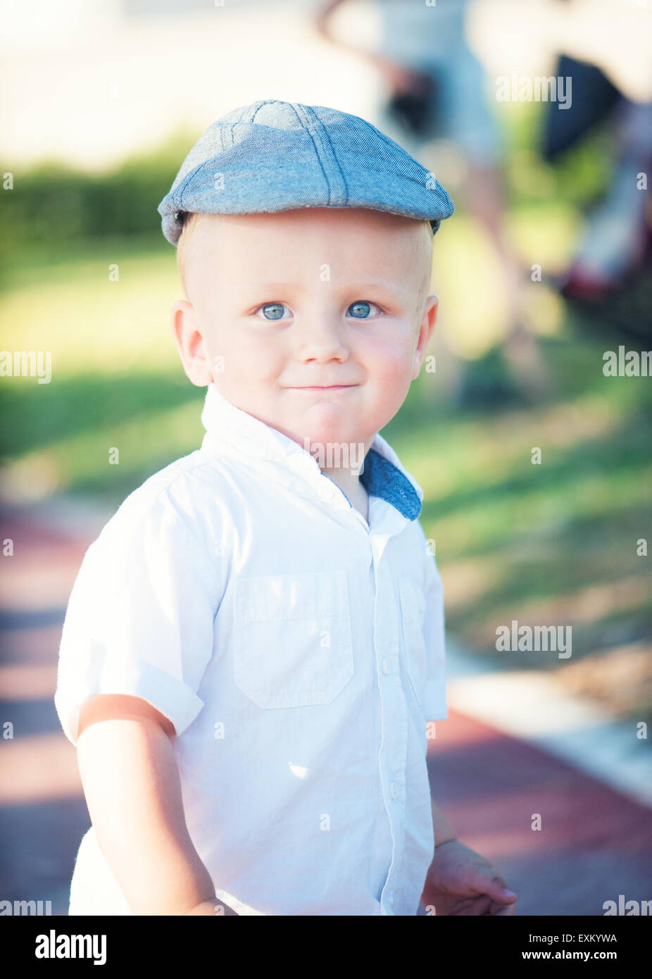 Cute little boy in a cap on a background of nature Stock Photo - Alamy