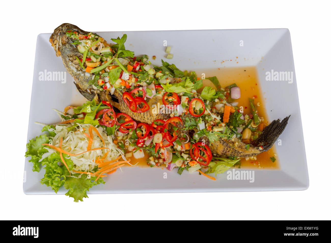 Deep fried snakehead fish serve with herb and spicy sauce isolated on ...