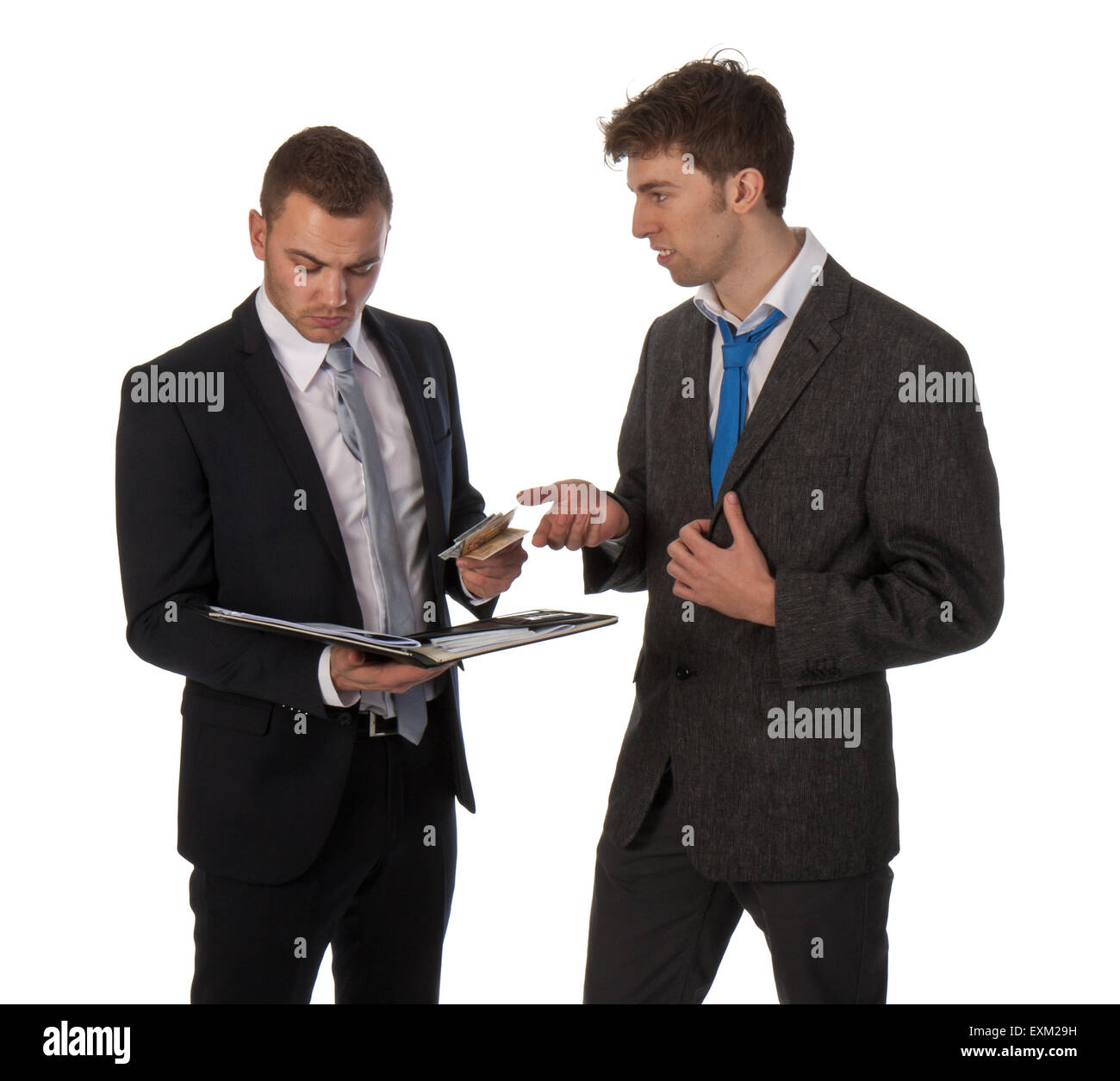 A businessman is checking some documents before paying the other ...