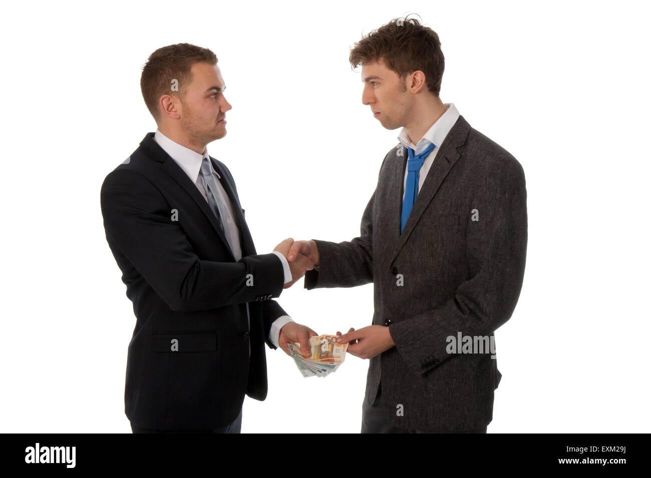 Businessman shaking hands. The deal is made and one businessman is ...