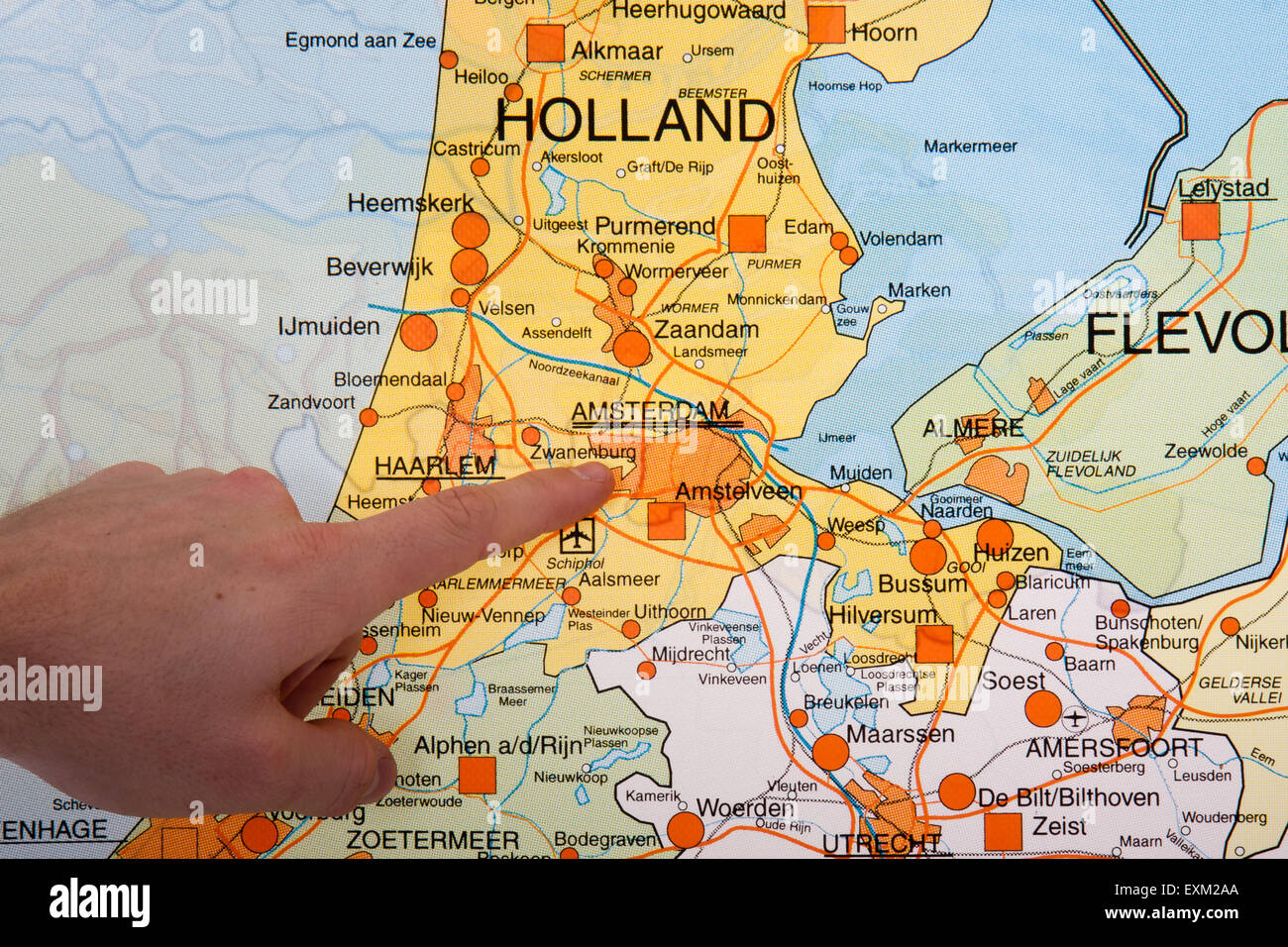 A Dutch map with a hand pointing to the capital city Amsterdam Stock ...
