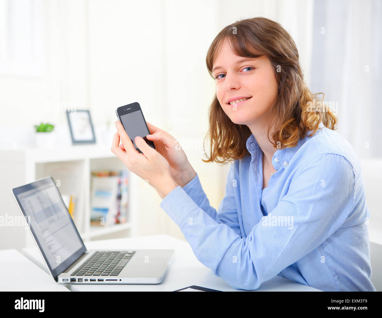 View of a young business woman writing a text on her mobile Stock Photo ...
