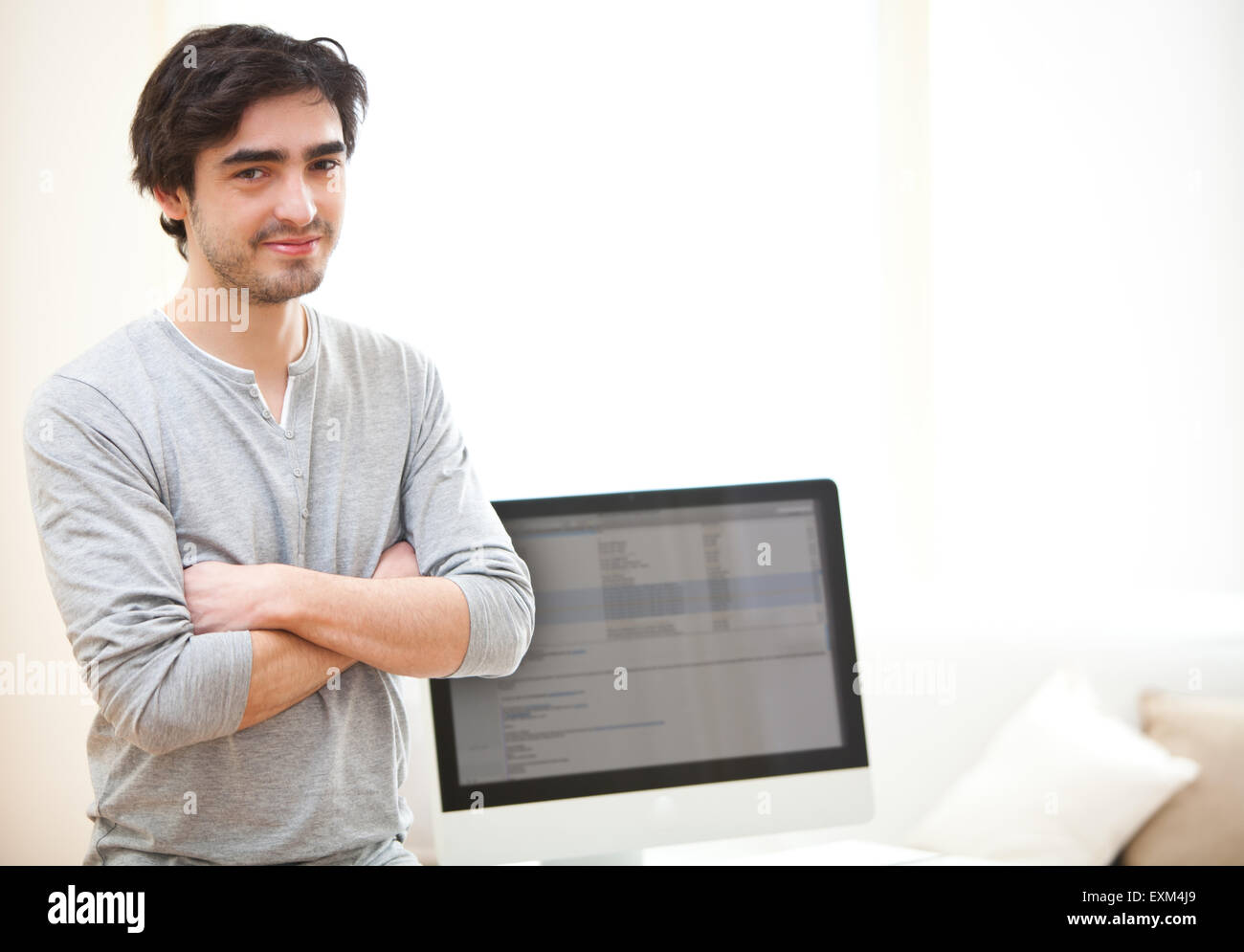 View of a young man in front of computer Stock Photo - Alamy