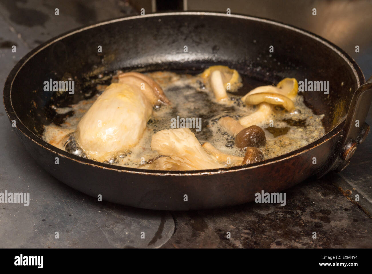 Filleted of round fish on a blue chopping board for college Stock Photo ...