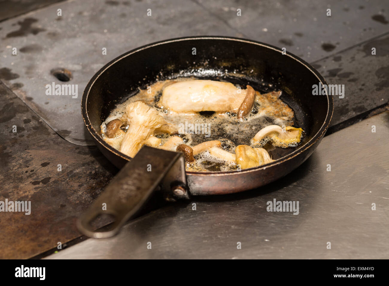 Filleted of round fish on a blue chopping board for college Stock Photo ...