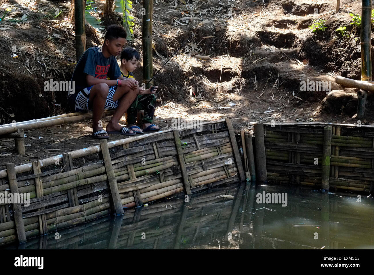 fishing indonesian style at a popular rural village man made pool near ...