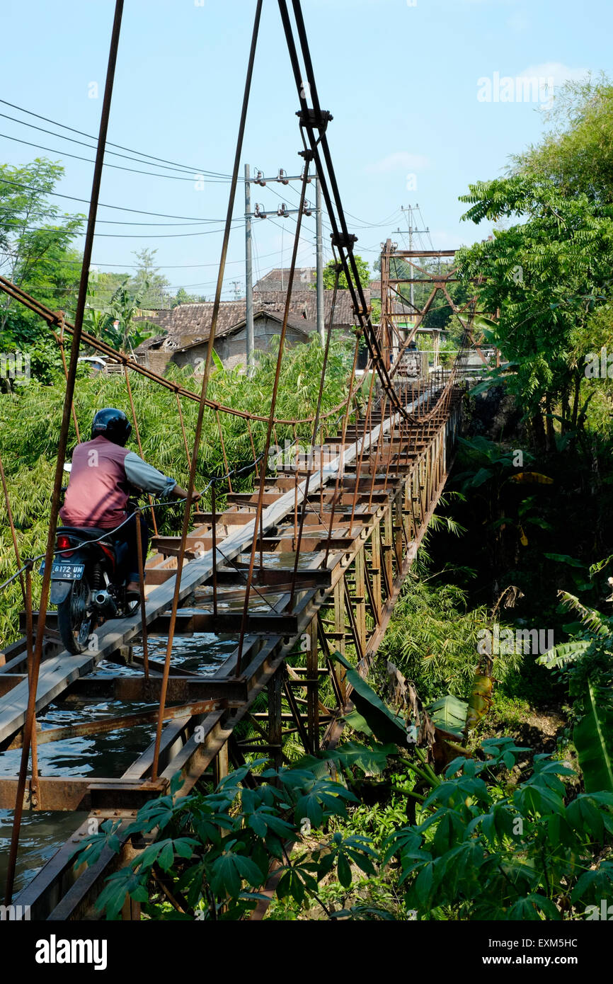dangerous unstable bridge over ravine not designed for people is used ...
