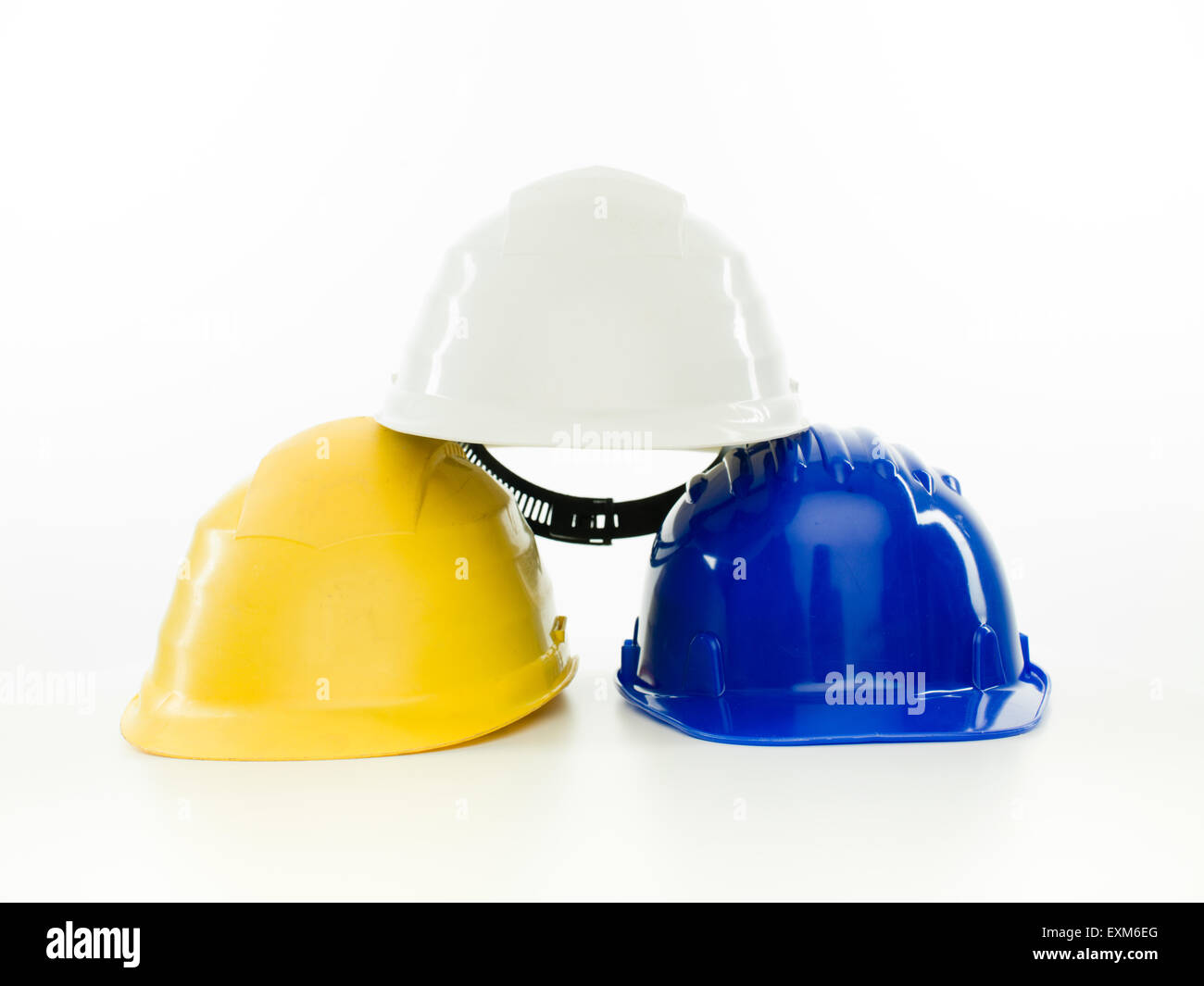 stack of multi colored hardhats isolated on white background Stock ...